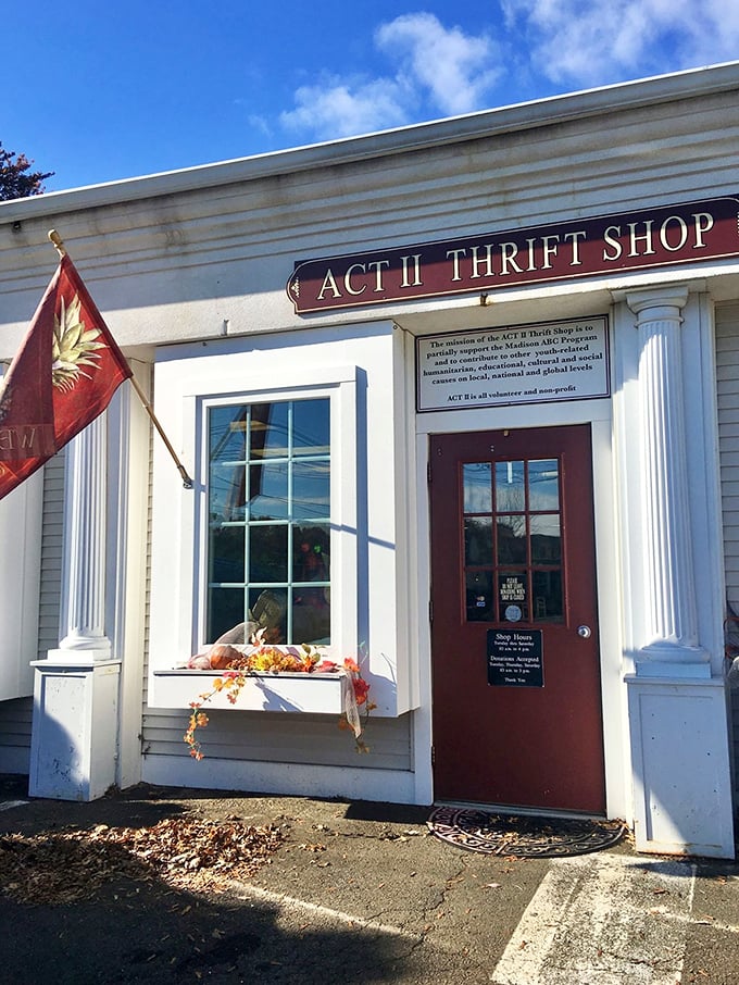 Classic white clapboard siding and traditional windows create the perfect backdrop for a thrift shop that embodies small-town values and big-hearted generosity.