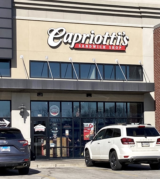 Window shopping for sandwiches! Capriotti's impressive glass frontage showcases their menu favorites, tempting passersby with visions of stacked delights.