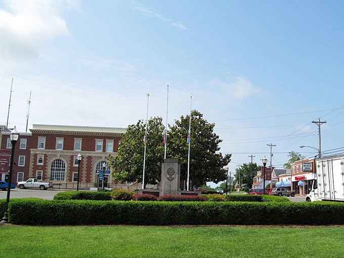 Leonardtown's traditional town square features manicured hedges, flagpoles, and the historic courthouse—a perfect spot for free relaxation during your day trip.