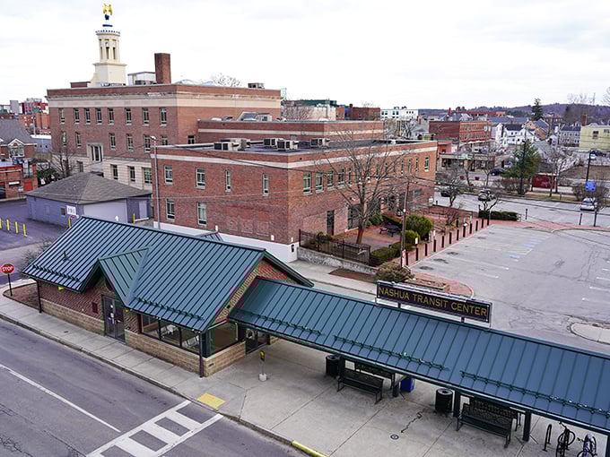 The Nashua Transit Center sits quietly amid the city’s brick-lined downtown—a calm pause before the next ride.