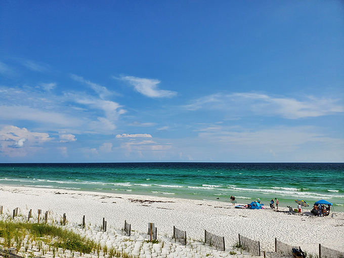 Santa Rosa Beach showcases nature's perfect color palette – where emerald waters meet powder-white sand under an endless blue sky.