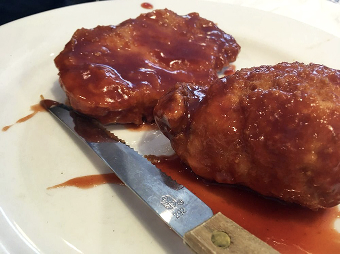 These pork chops aren't just broasted, they're transformed – wearing their sauce like a glossy magazine cover model.