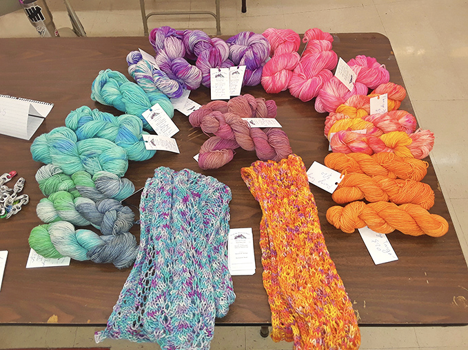 A color wheel of hand-dyed yarns that would make any knitter weak in the knees—each skein a promise of cozy creations to come.